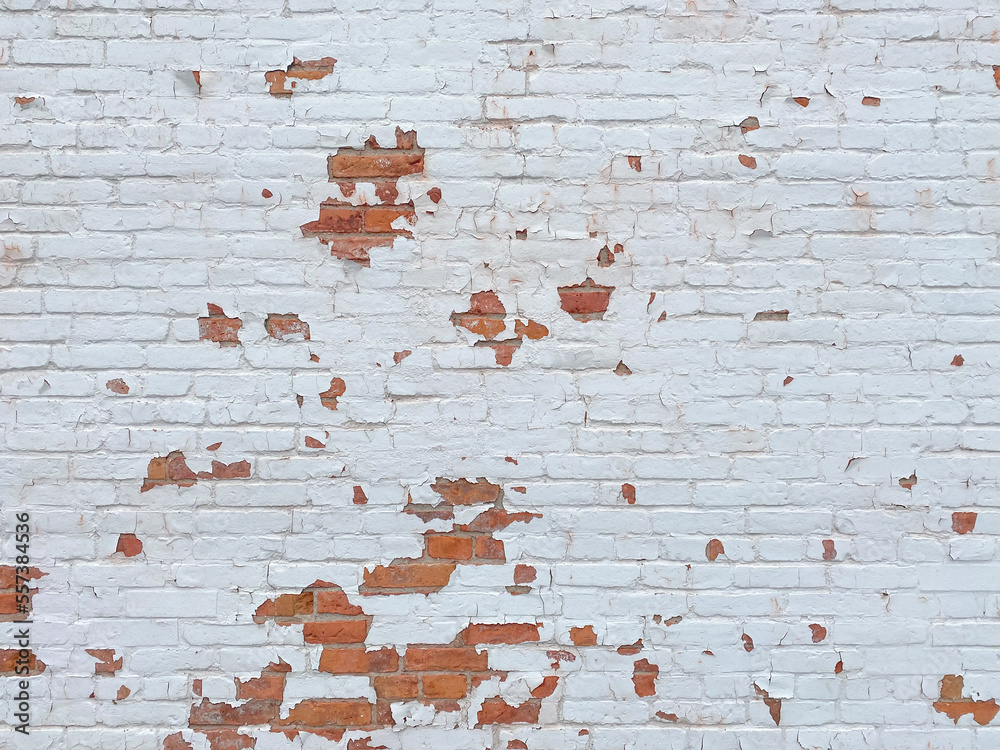 Red brick wall painted white with chipping paint. Stock Photo | Adobe Stock