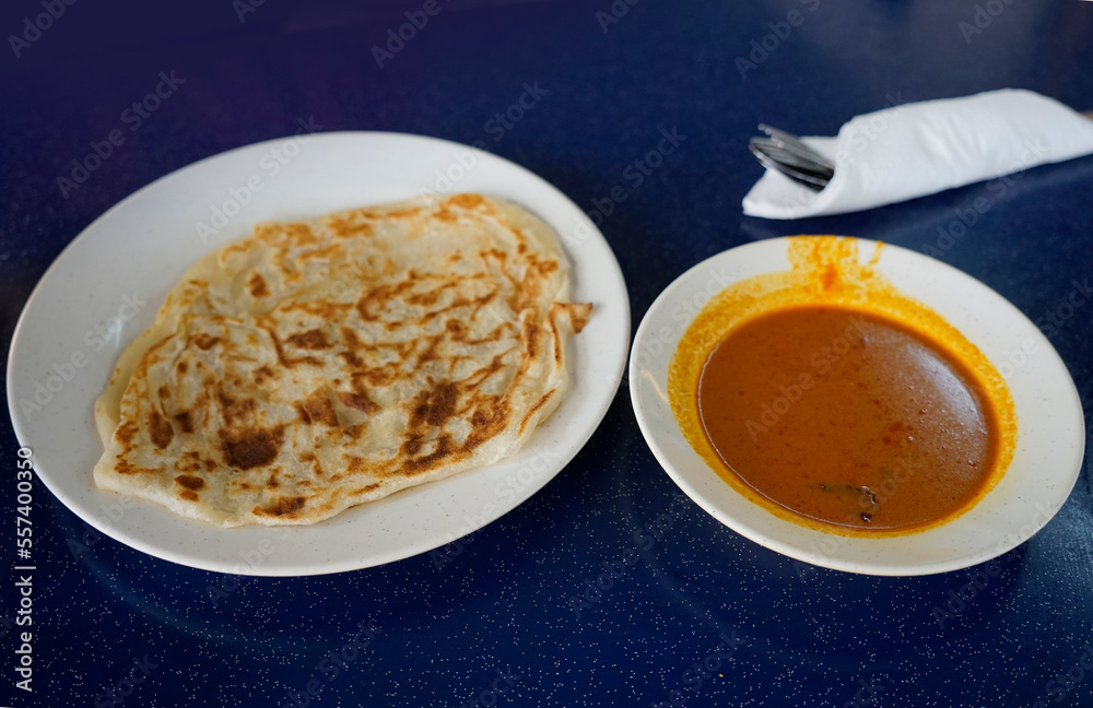 Simple breakfast in Malaysia with Roti Canai served with dal curry ...