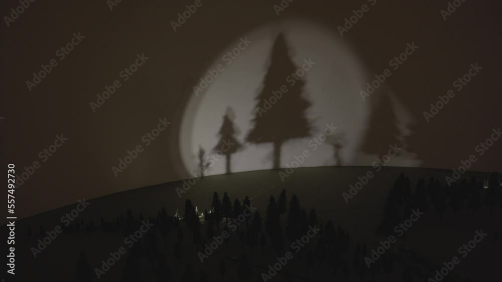 This video shows a surreal shadow puppet show of forest trees and ...