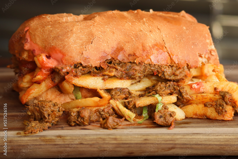 Masala steak Gatsby. Traditional South African fast food with steak and ...