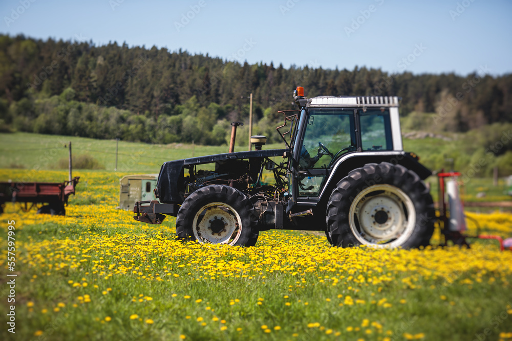 Tractor with a disc harrow system on the cultivated farm field, process ...