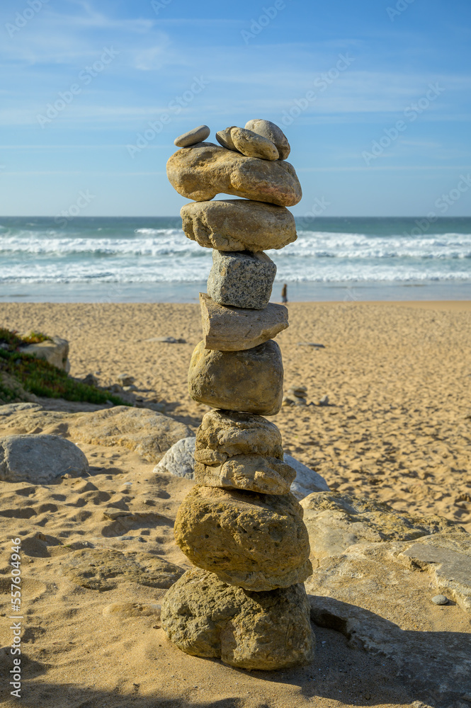 Pyramid from stack balanced stones on sandy beach, Atlantic ocean ...