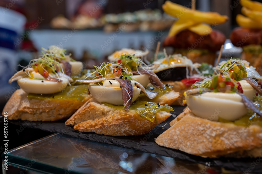 Typical snack of Basque Country, pinchos or pinxtos, small piece of ...