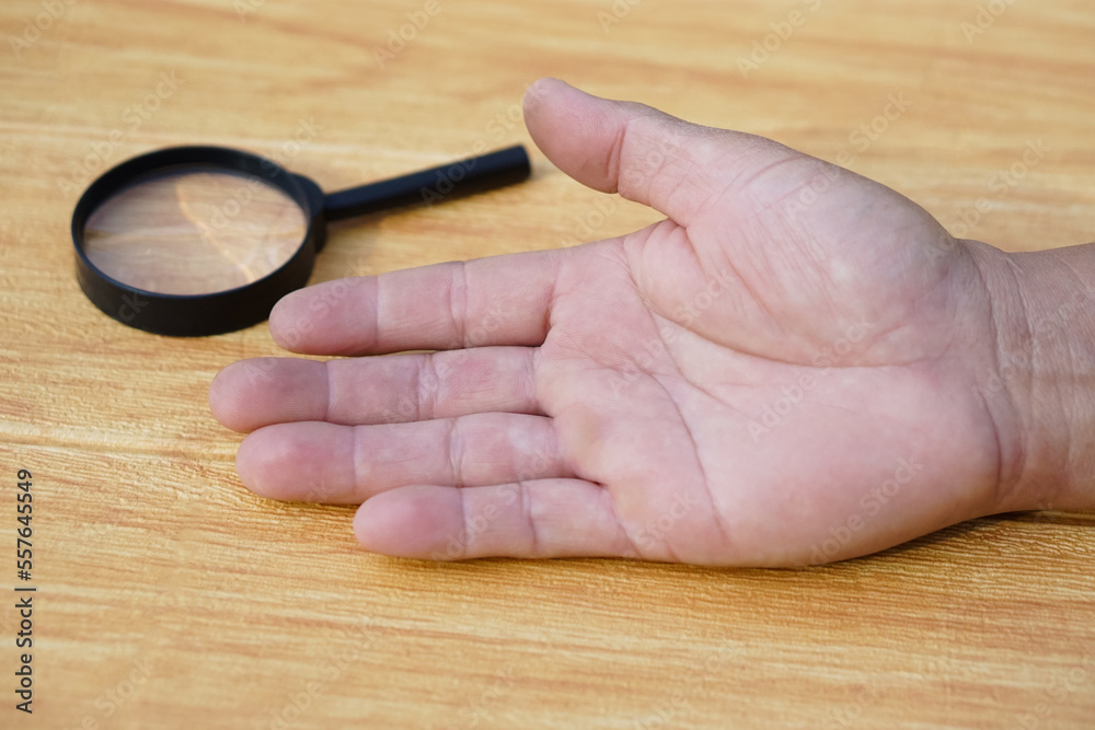 Palm lines and magnifying glass. Concept : palmistry, astrology ...
