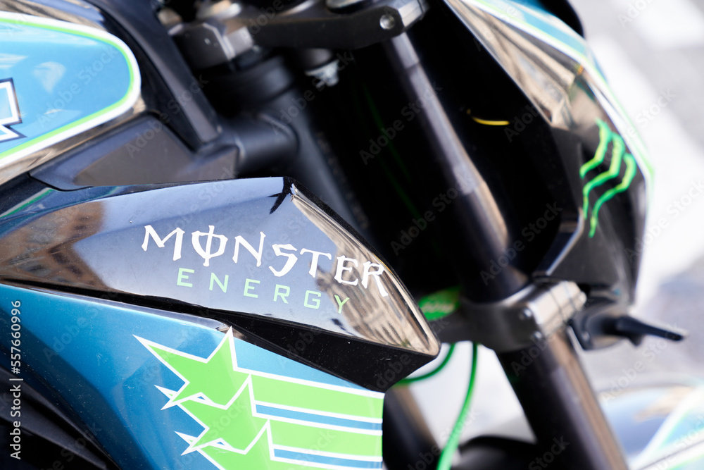 Monster Energy Drink text sign and logo brand on side motorcycle ...