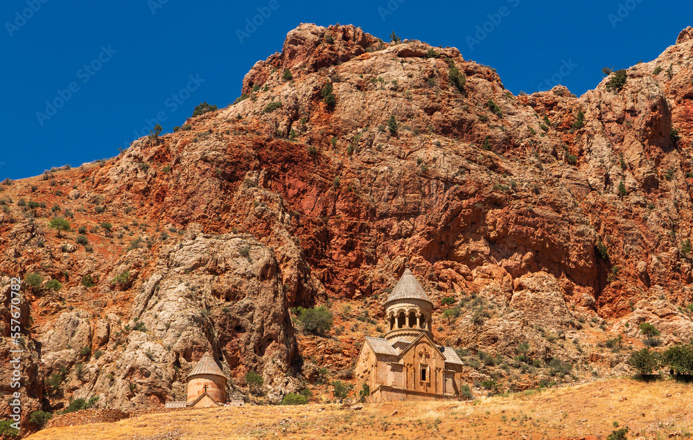 Noravank monastery complex built on ledge of narrow gorge. Tourist and ...
