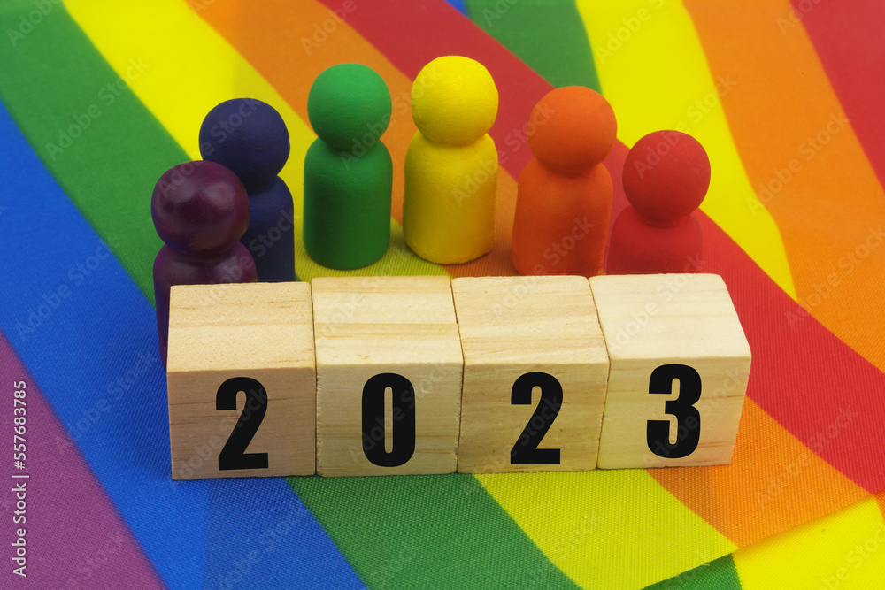 LGBT pride flag and rainbow colored people figures with numbers 2023 on ...