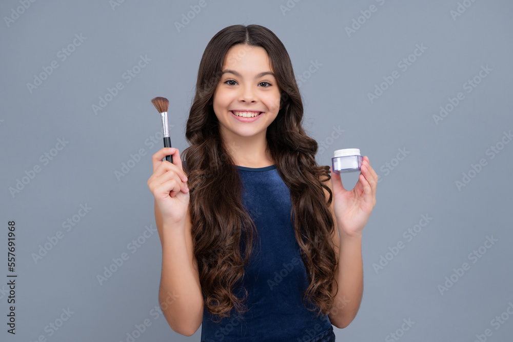 Child teen girl making beauty make up, hold powder and brush. Beautiful ...