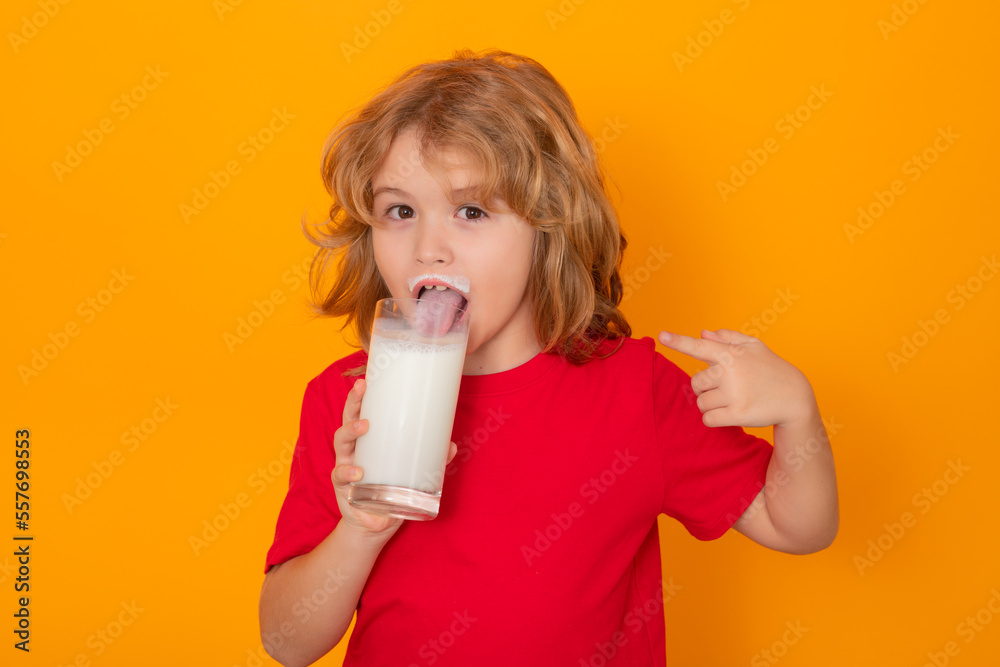 Cute little child with glass of milk on studio color background. Kid ...
