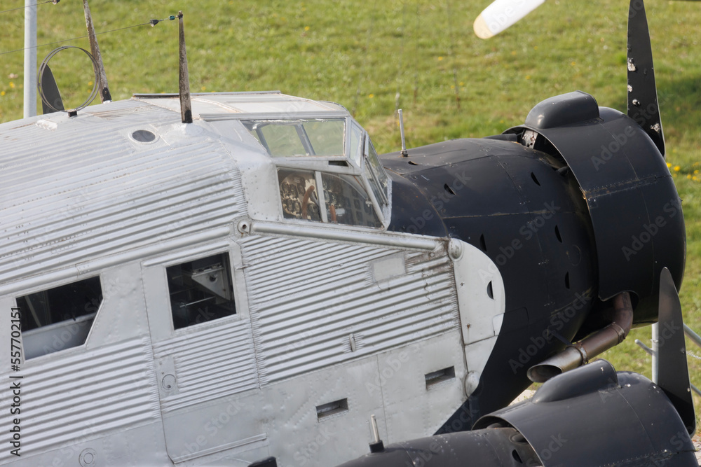 Cockpit and mid-engine of a three-engine old Junkers JU52 transport and ...