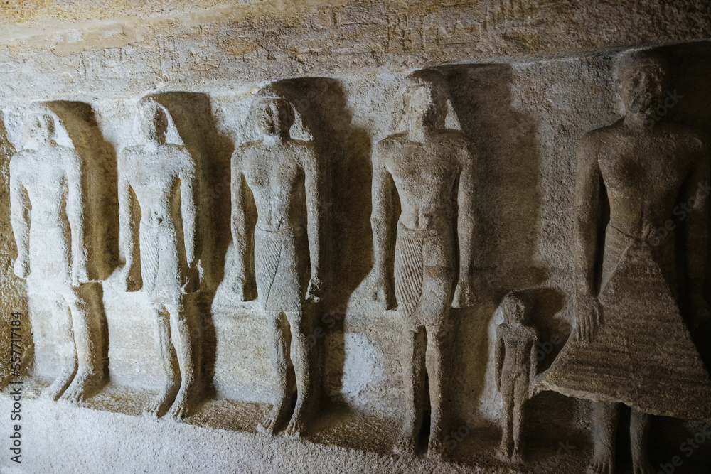Ancient Egyptian statues in a tomb next the pyramids of Giza in Cairo ...