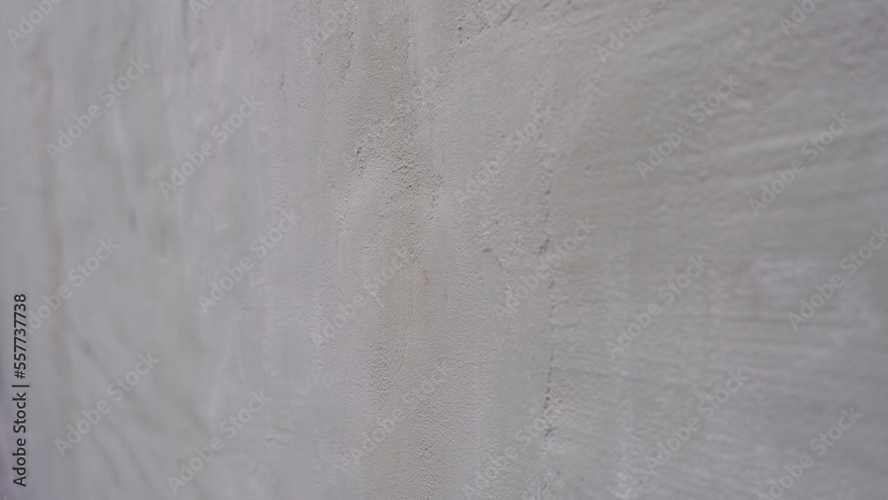 Gray structural painted wallpaper on the wall. Grunge texture ...