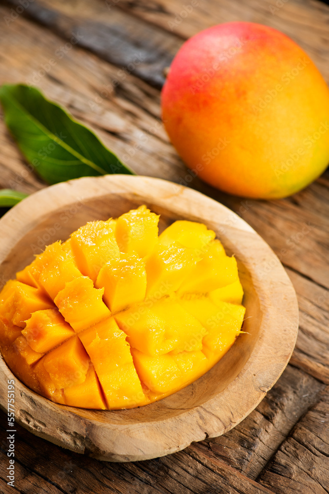 Mango fruit. Ripe Mango fruits over wood background. Close-up of fresh ...