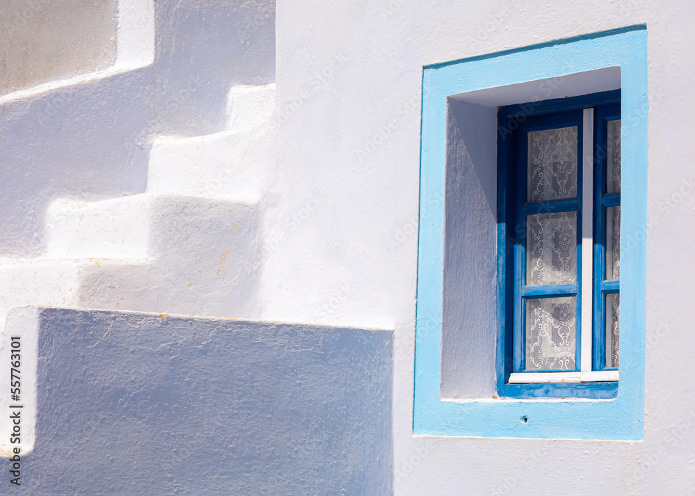 A famous blue painted window of the Greek Islands- Santorini. A vibrant ...
