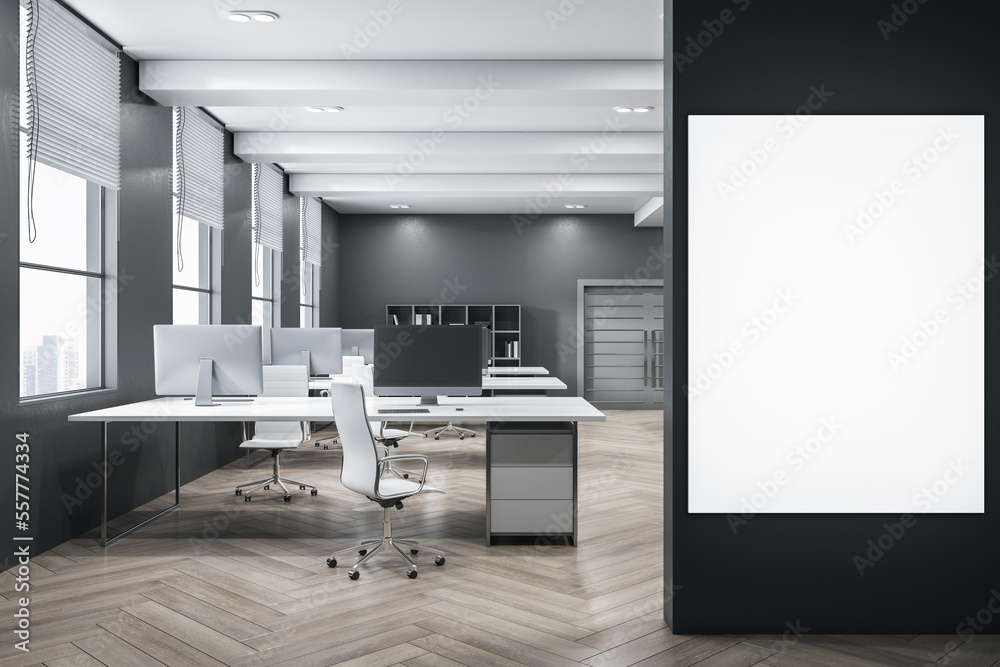 Front view on blank white poster on dark wall in stylish open space ...