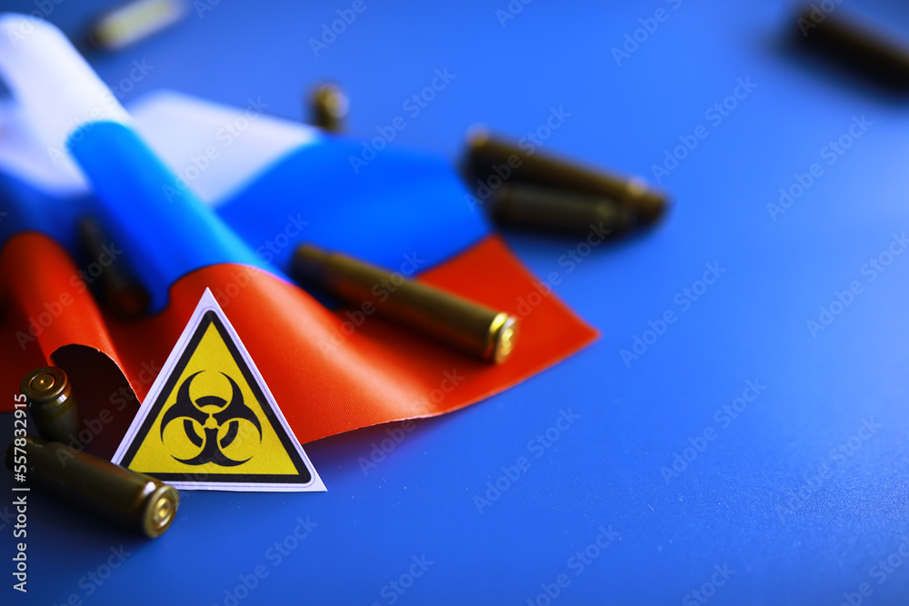 Russian flag and bullet casings on the table. Background concept ...