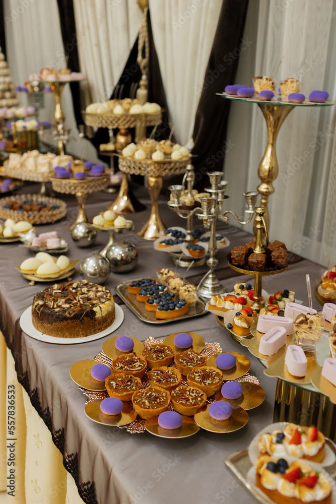 Table with cakes, sweets, candy, buffet. Dessert table for a party ...