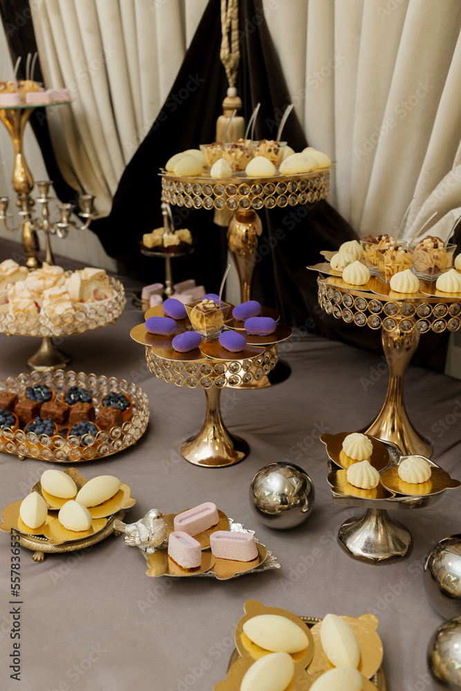 Table with cakes, sweets, candy, buffet. Dessert table for a party ...