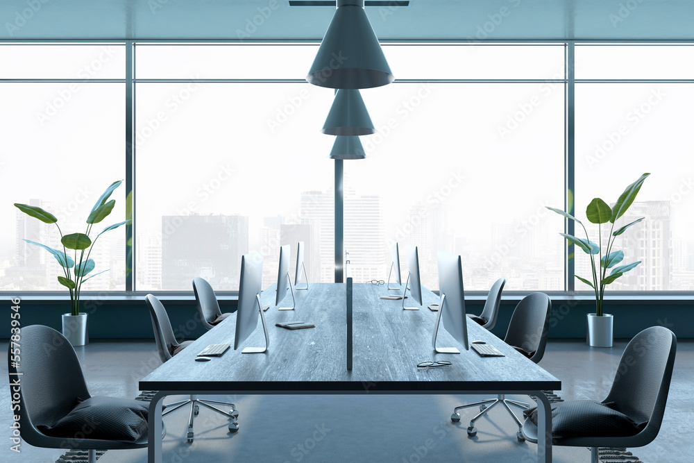 Side view on huge dark wooden conference table with modern laptop ...