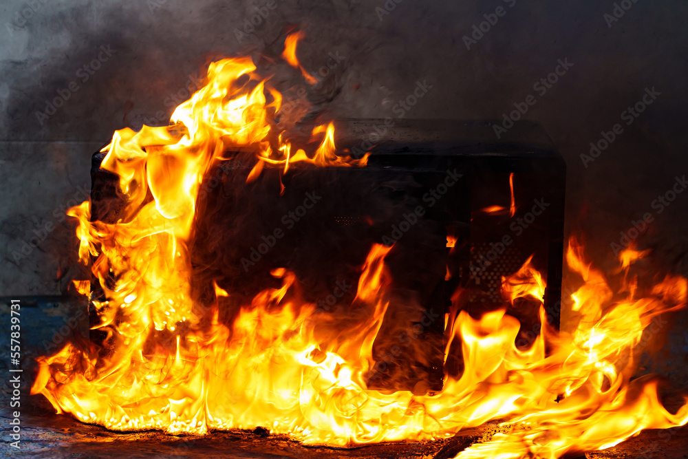 microwave oven on fire. the concept of fire in the kitchen and ...