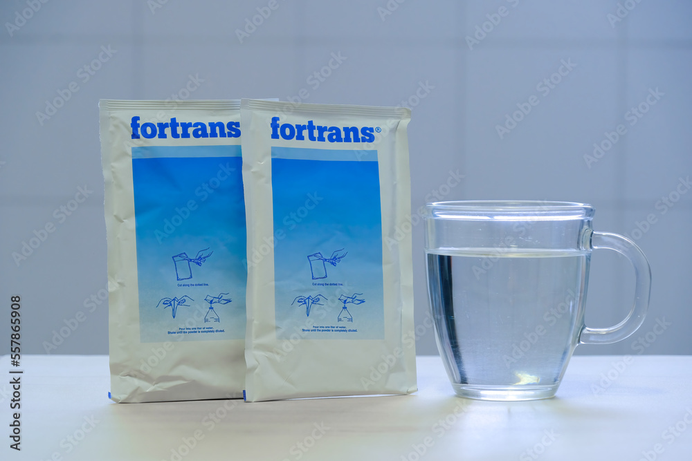 Singapore 2021 - 2 packets of Fortrans with a glass of water on table ...