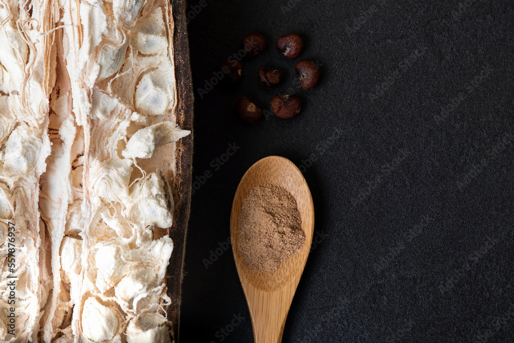 Baobab pulp, seeds and powder on black ceramic background. Stock Photo ...
