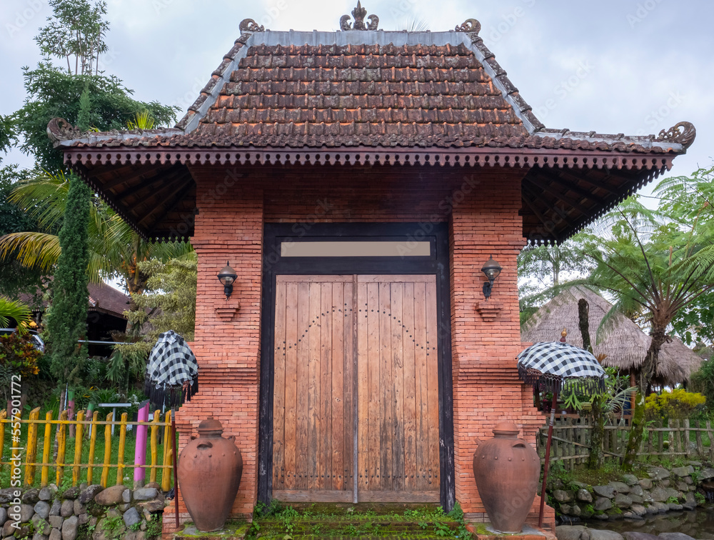 Traditional Balinese house gate with bricks and wood. Balinese ...