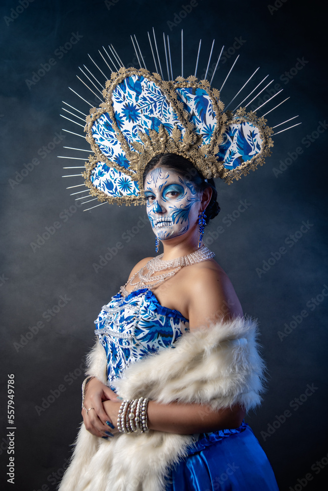 Mexican catrina woman dressed in talavera type costume in blue colors ...
