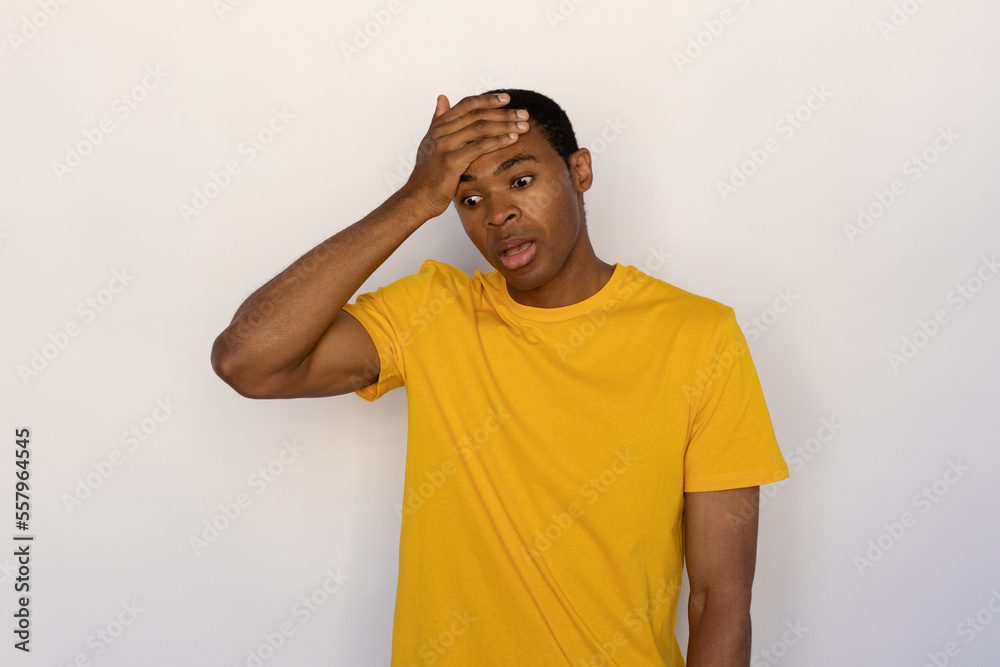 Amazed young man facepalm. Male African American model with brown eyes ...