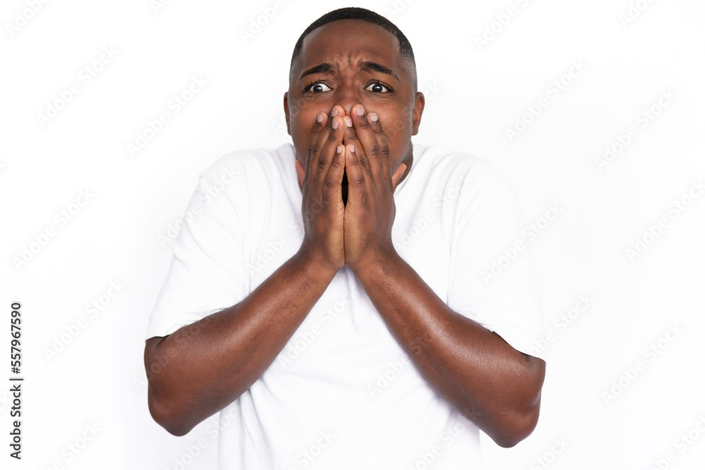 Scared African American man covering face. Portrait of shocked young ...