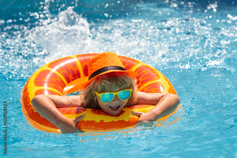 Kid boy relaxing in pool. Child swimming in water pool. Summer kids ...