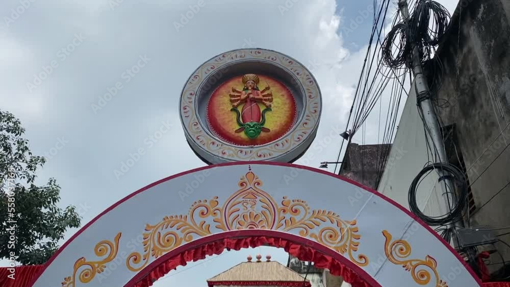 Low angle shot of a decorated entrance gate of a Goddess Durga puja ...
