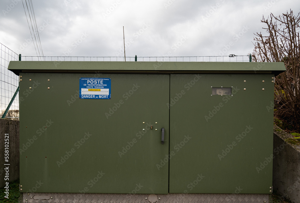 High voltage transformer against the blue sky.Electrical power ...