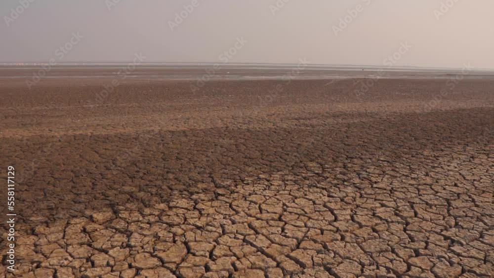Landscape view of dusty, drought land in summer season at Little Rann ...