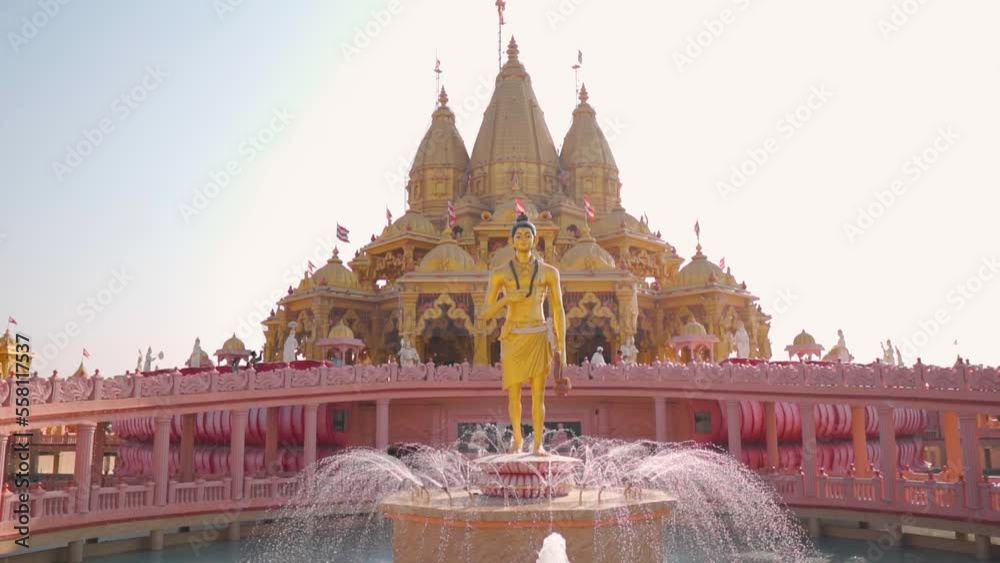 Wide angle shot of Statue of Hindu God against beautiful Swaminarayan ...