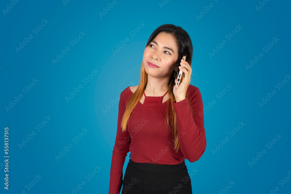 Beautiful woman standing, talking on the phone, turning to the right ...