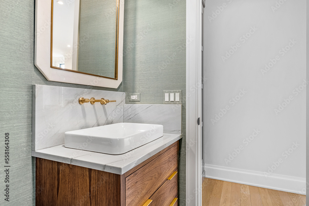 Luxury Powder Room with Lighted Mirror and Views to the Hallway. Wooden ...