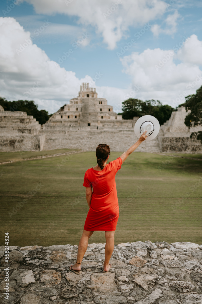 Travel woman in red dress looking at mayan ancient pyramid Etzná, Campeche, Mexico, Yucatán ...