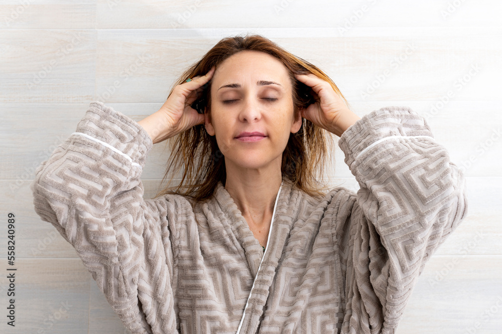 Woman Giving Herself A Head Massage After Shower In A Bathrobe Hair