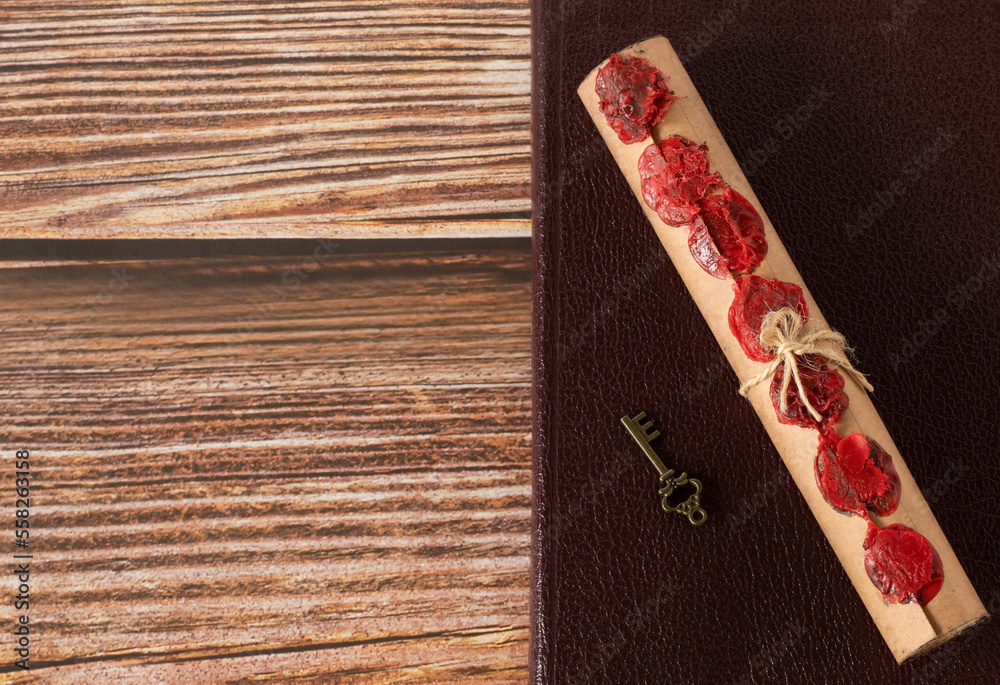 Scroll with seven seals and ancient key on top of closed holy bible ...