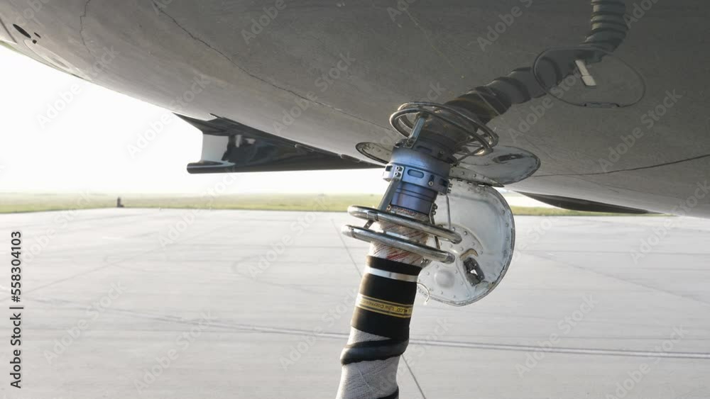 Air Start Unit (ASU) Discharge Air Hose Attached To Aircraft Underbelly ...