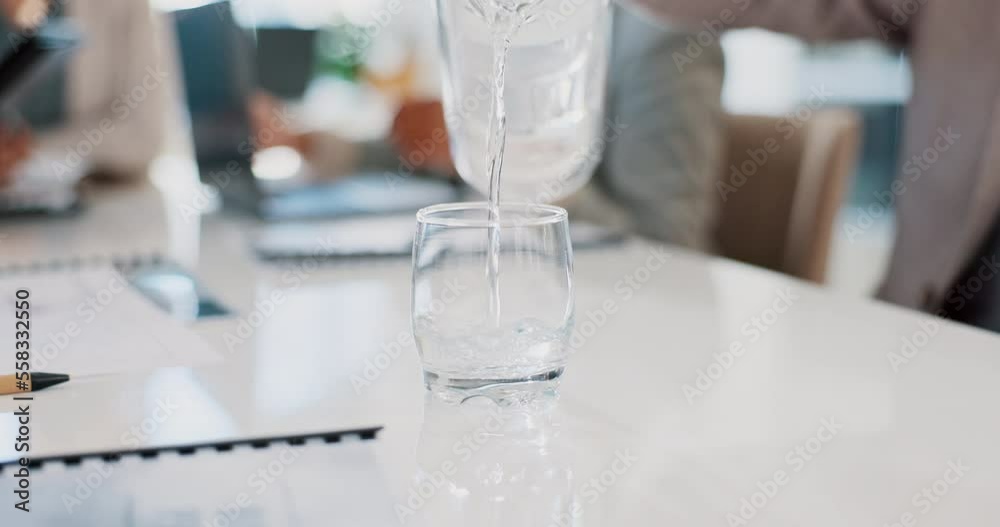 Glass, table or pouring water in meeting for thirsty employees or business people in an office ...