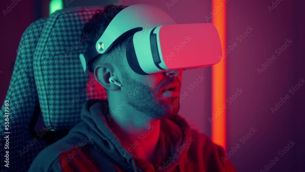 Man watching movie using virtual reality glasses. man makes swiping and ...