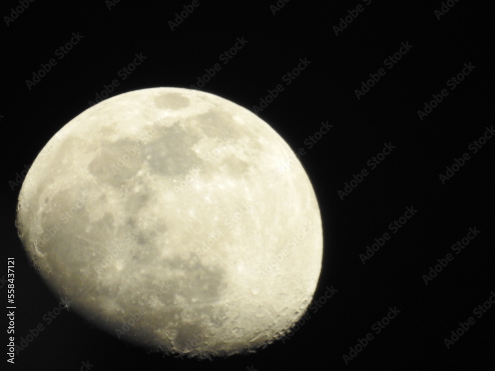 Telescopic view of a full moon. Full moon shot showing details of the ...
