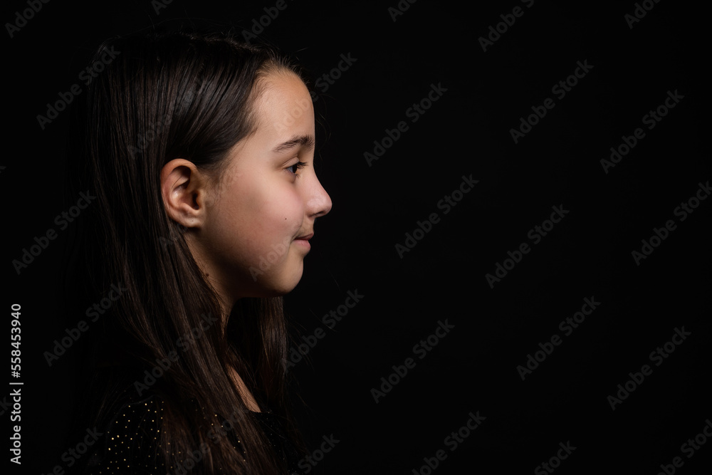 Profile side view face brown-haired little girl standing isolated on ...