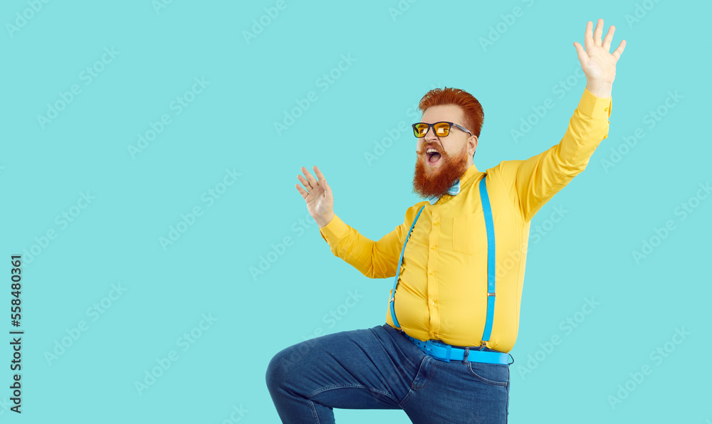 Funny cheerful fat man in funky outfit having fun at crazy party. Happy ...