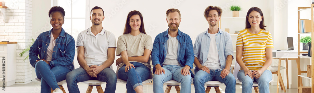 Team of people sitting together. Group portrait of happy diverse young ...
