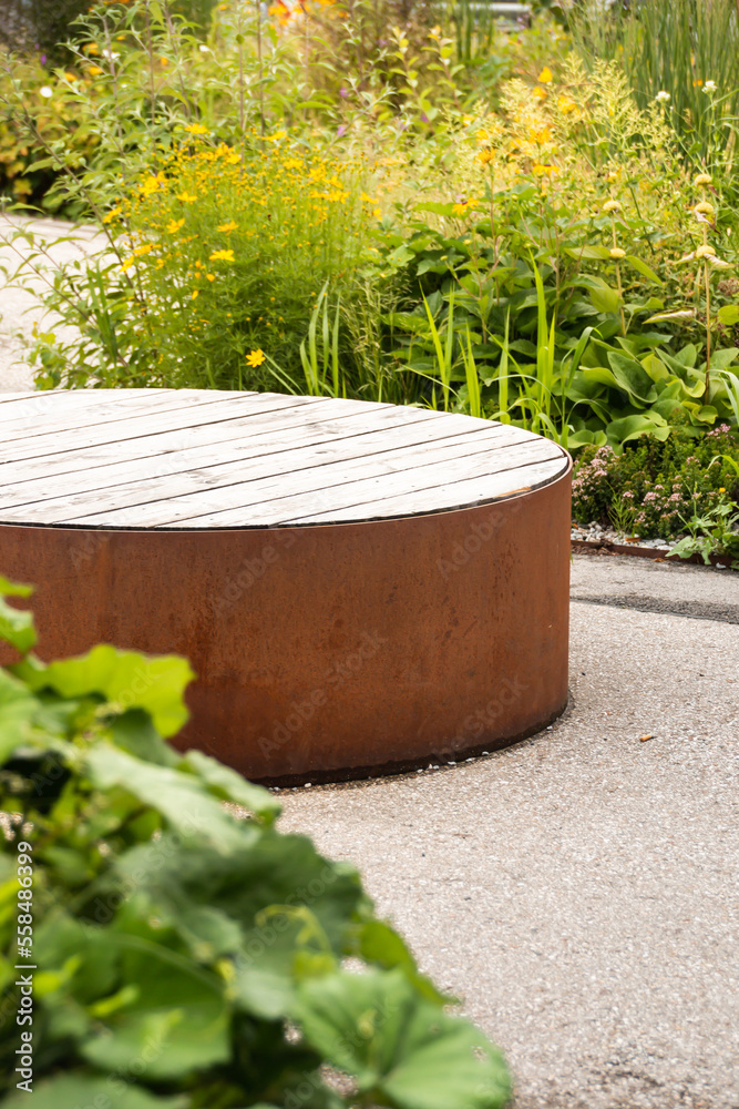Corten bench in the garden Stock-Foto | Adobe Stock