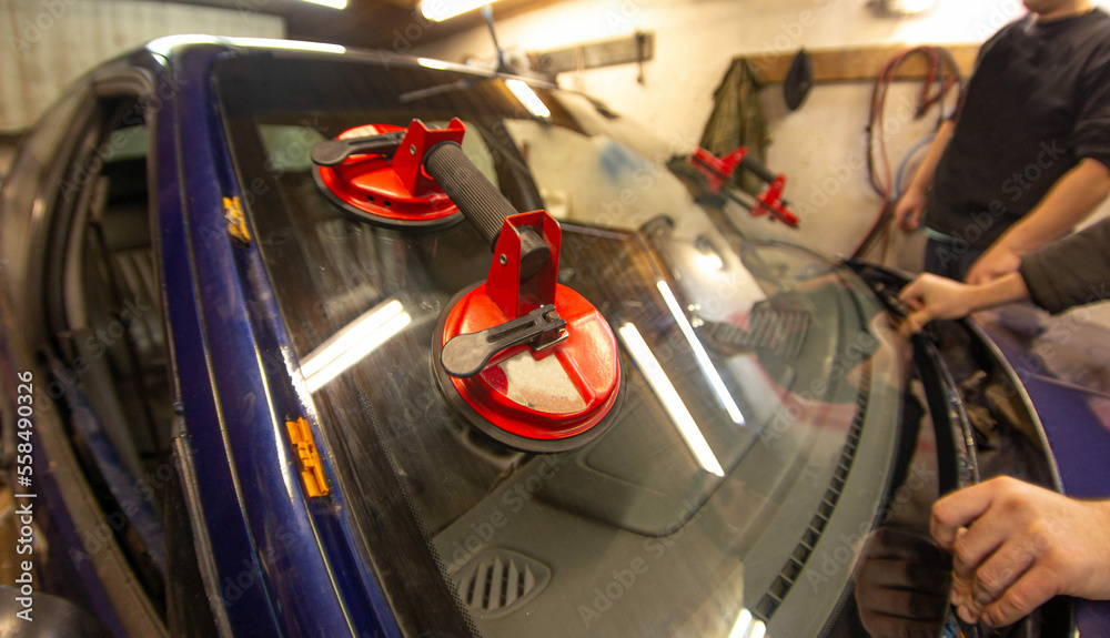 installation of a new and replacement of the windshield of the car ...