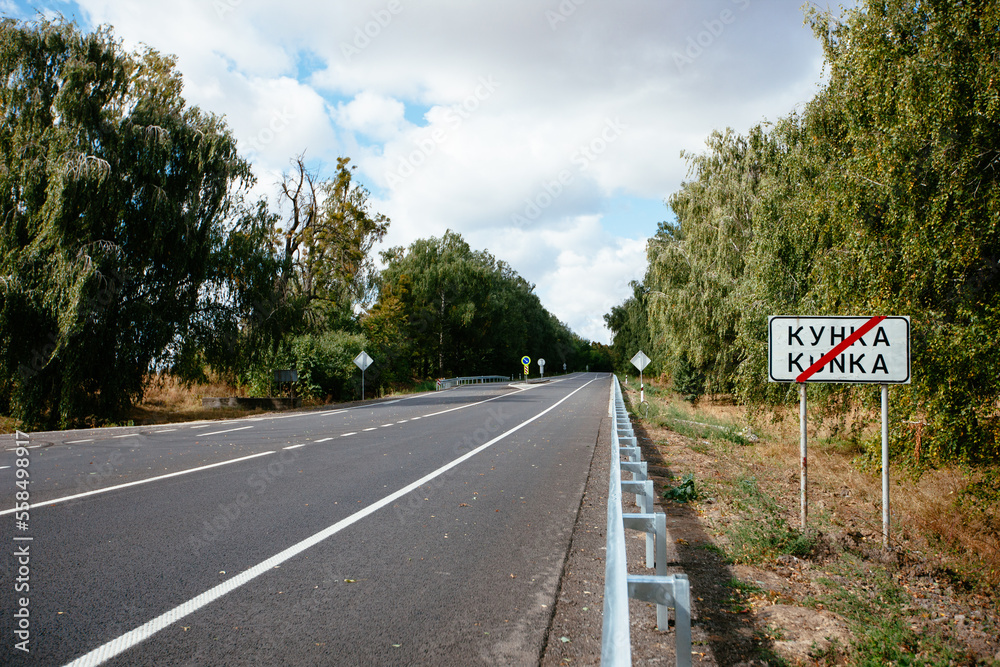 New asphalt road with markings and road signs in the sun's rays Stock ...
